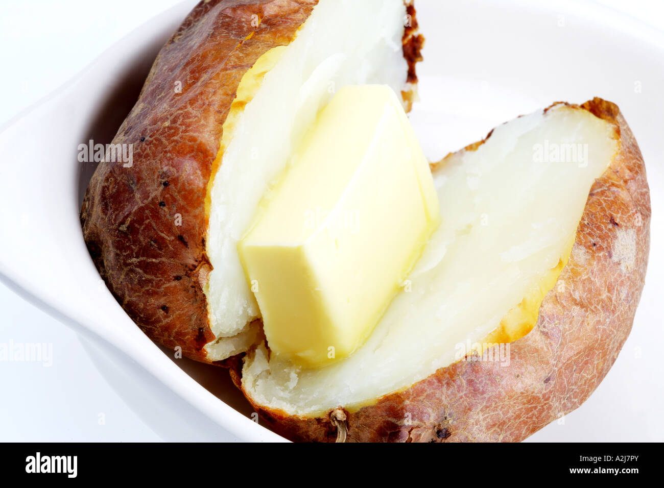 Jacket Potato with Butter Stock Photo - Alamy