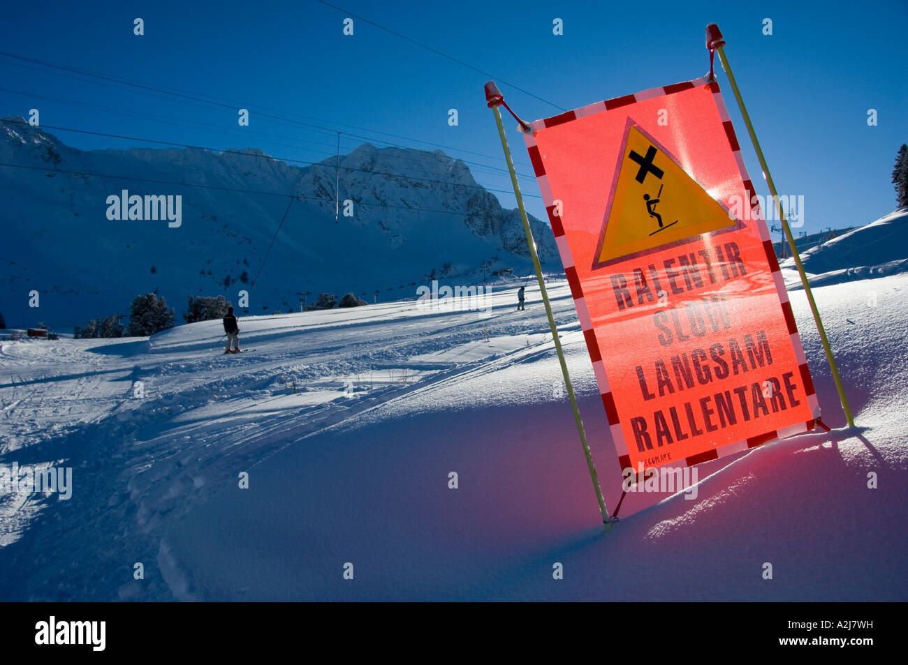 Slow sign for skiers crossing a ski tow track at La Plagne in the ...