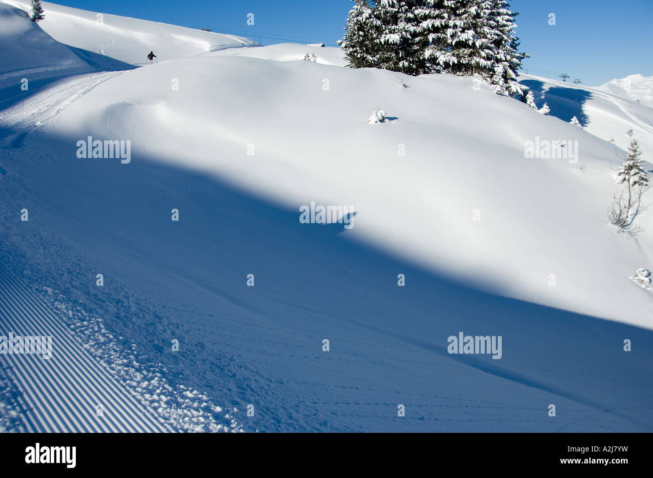 Winter landscape with snow slope and silhouette of walker Stock Photo ...