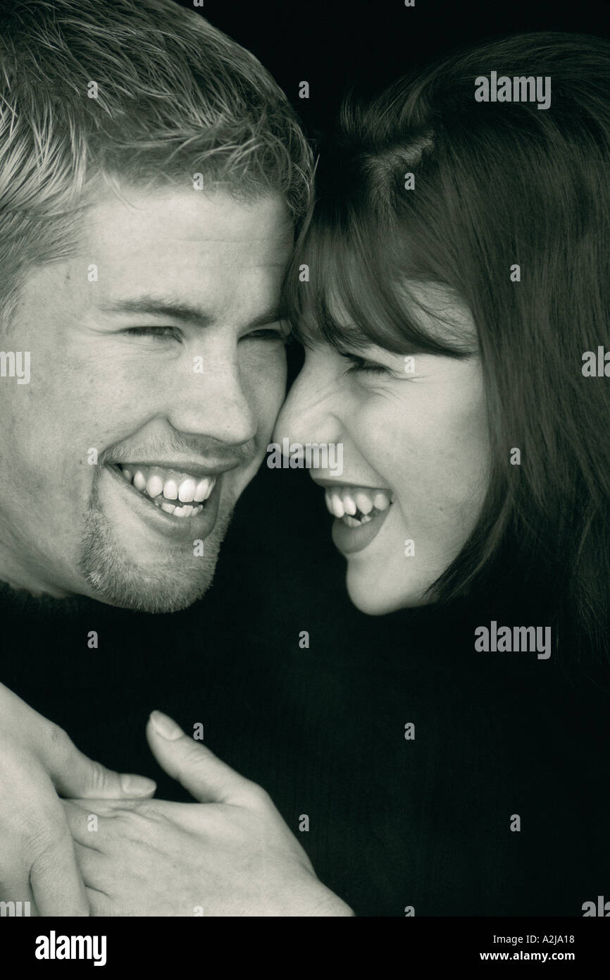 Portrait of a happy couple cheek to cheek Stock Photo - Alamy