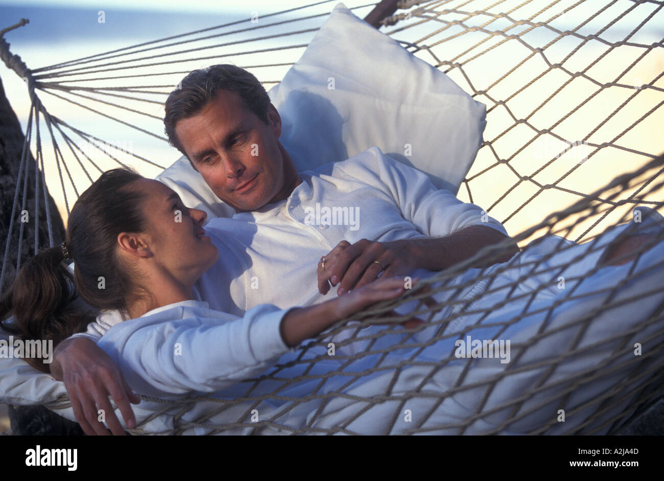 Happy couple gaze others eyes hi-res stock photography and images - Alamy