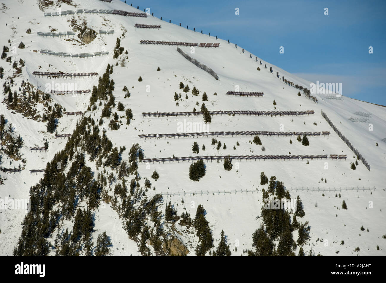Avalanche protection barriers on a steep hillside Stock Photo - Alamy