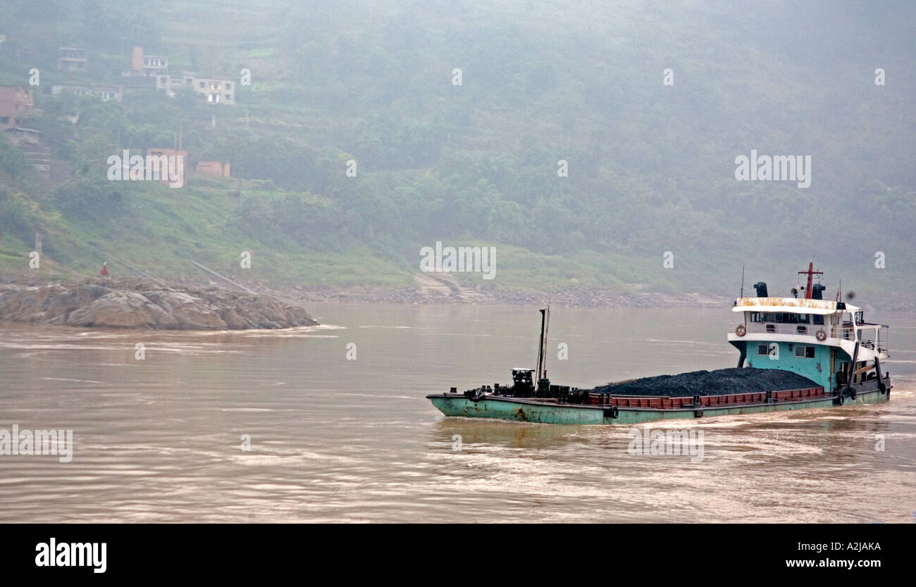 CHINA YANGTZE RIVER Barge loaded with coal from strip mines travels ...