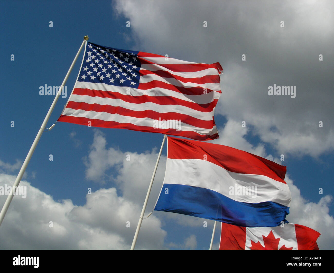 American flag blue sky fluffy white clouds hi-res stock photography and ...