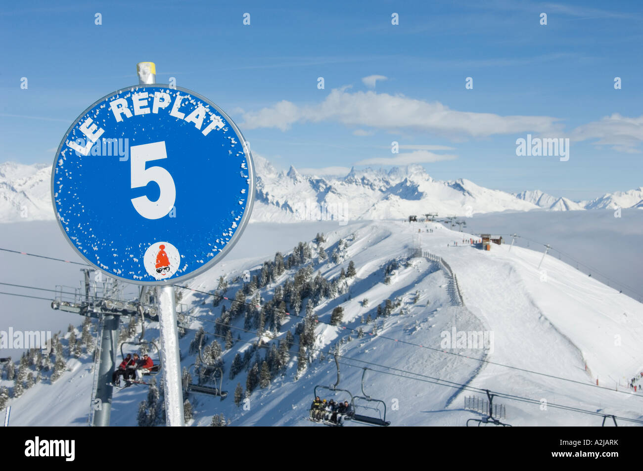 Blue ski piste sign in the French alps with chairlift and mountain ...
