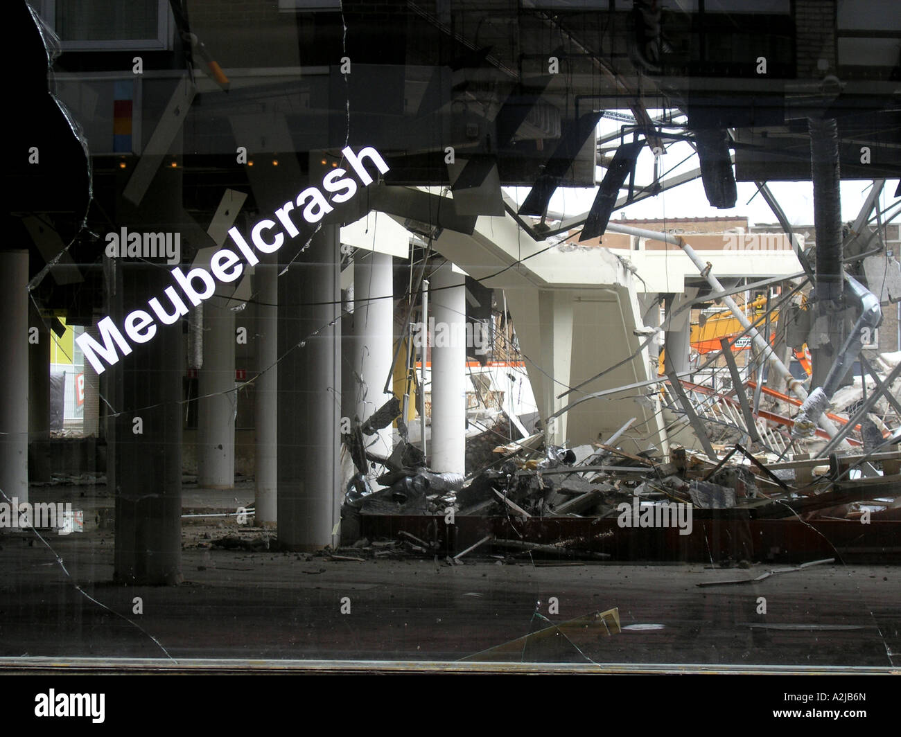 interior view of demolished building with steel and rubble lying about ...