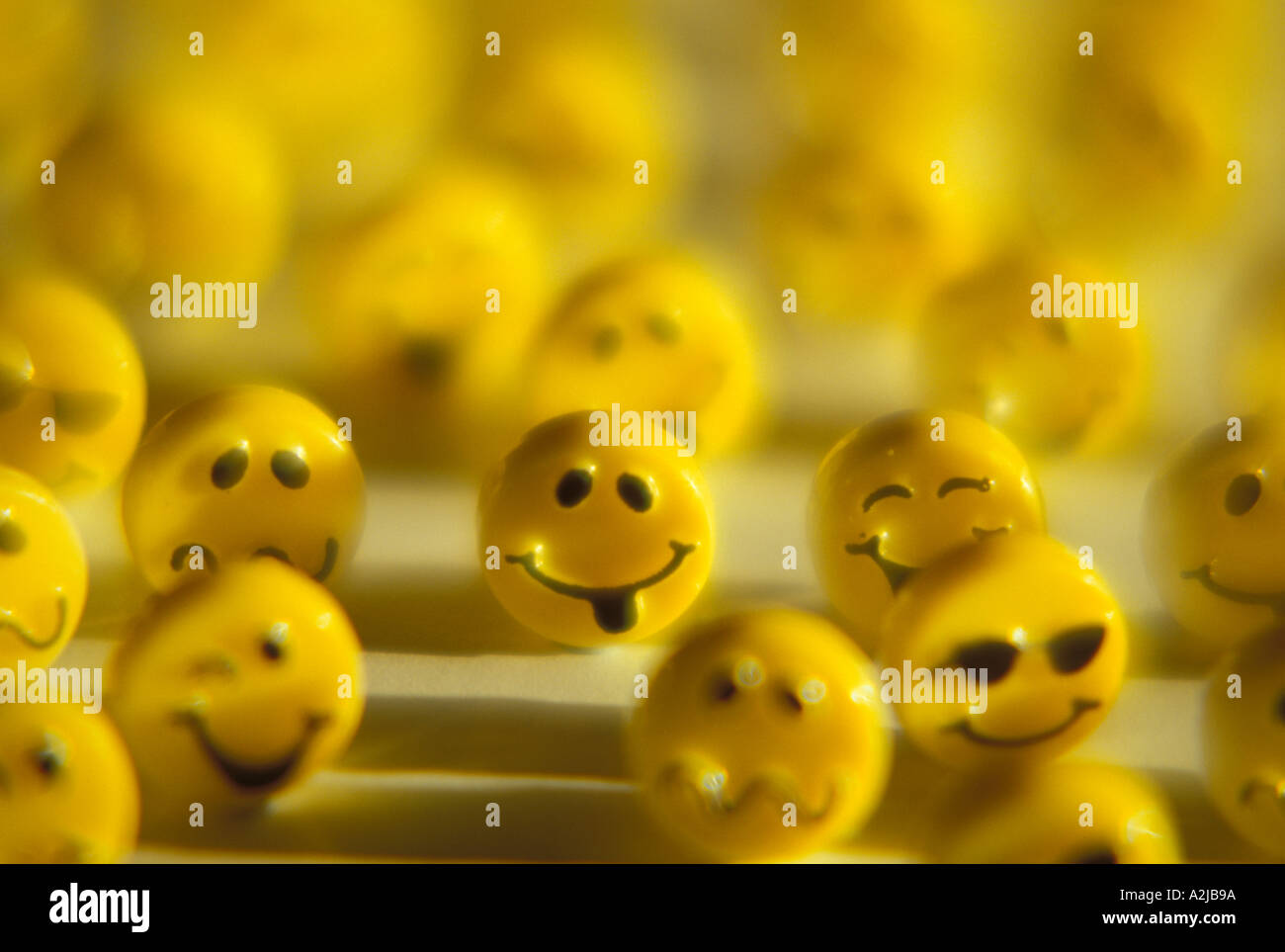 Still life of a group of yellow happy faces with various expressions ...
