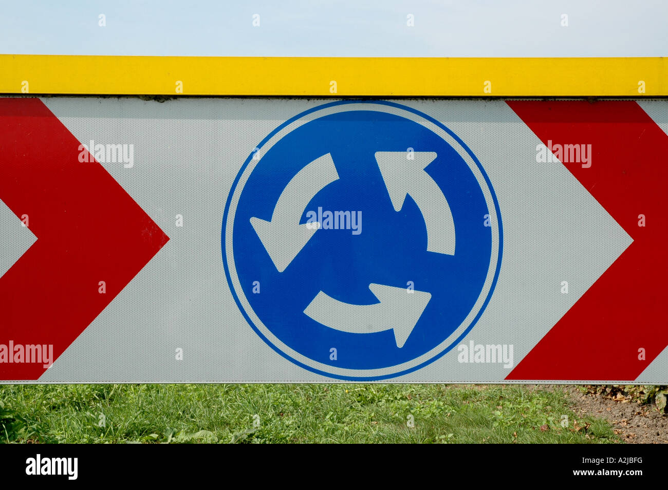 traffic sign indicating direction of travel at continental roundabout ...