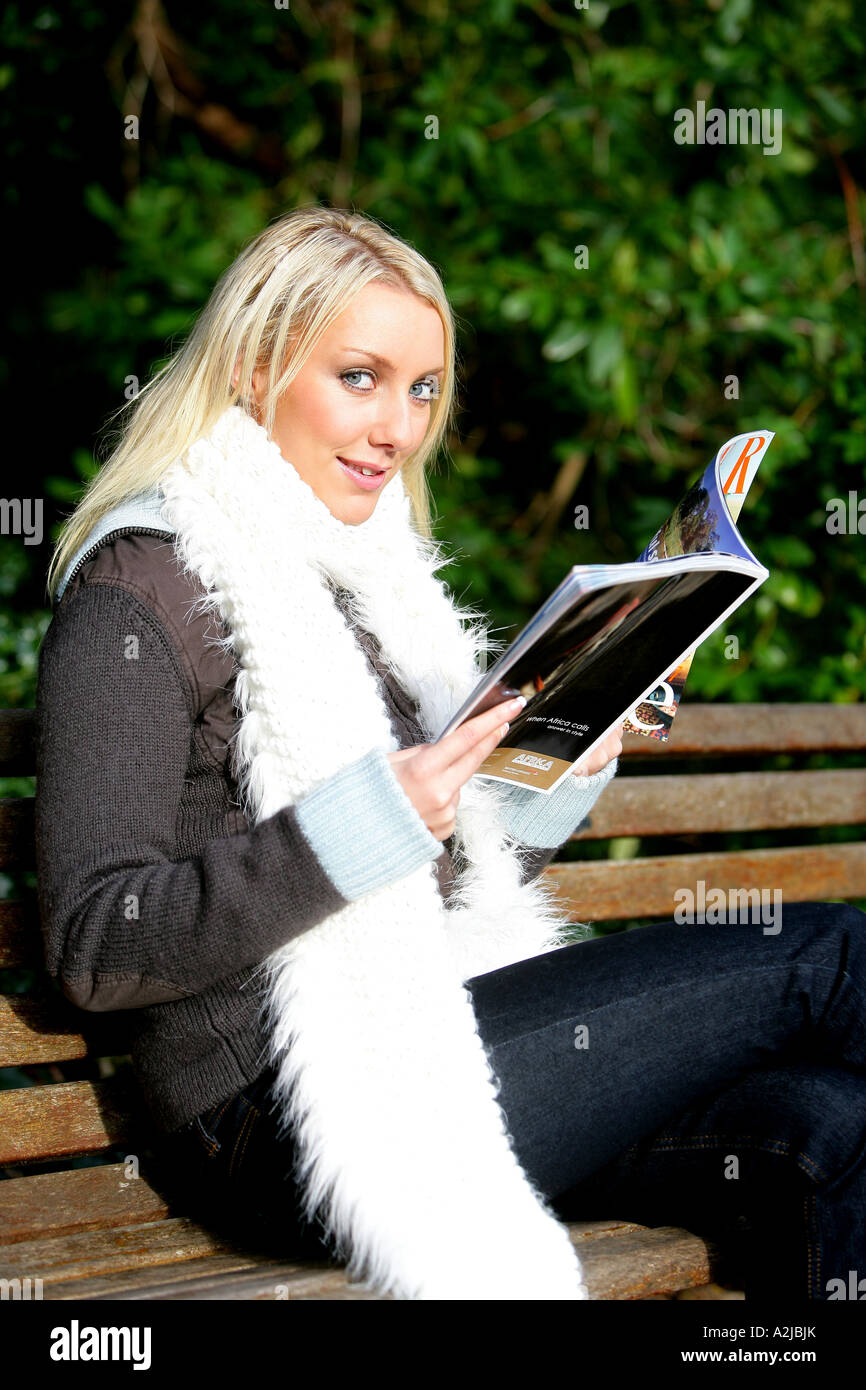 Young Woman Reading a Magazine in a Park Model Released Stock Photo - Alamy