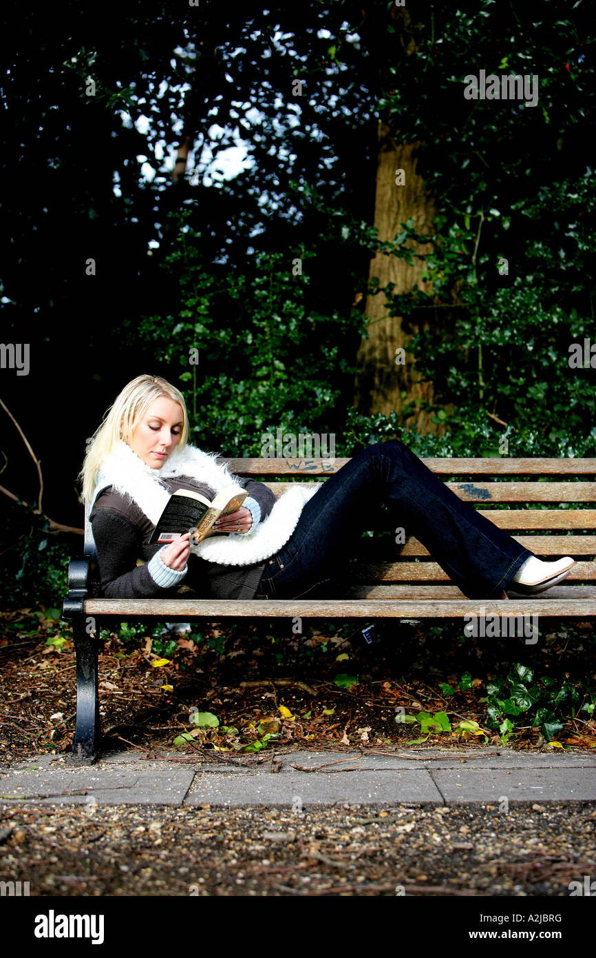 Young Woman Reading a Magazine in a Park Model Released Stock Photo - Alamy