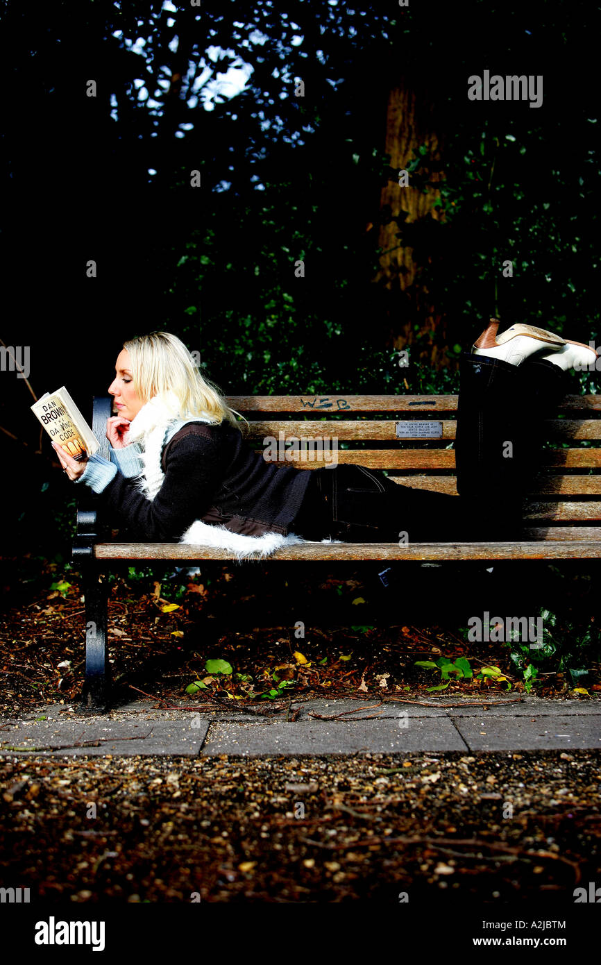 Young Woman Reading a Magazine in a Park Model Released Stock Photo - Alamy