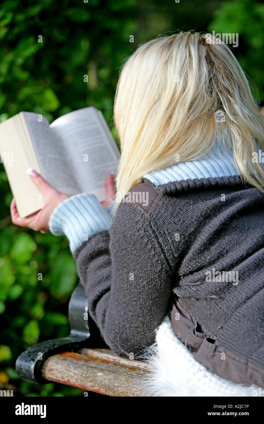 Young Woman Reading a Magazine in a Park Model Released Stock Photo - Alamy