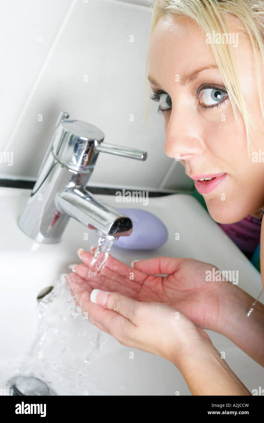 Young Woman Washing Face Model Released Stock Photo - Alamy