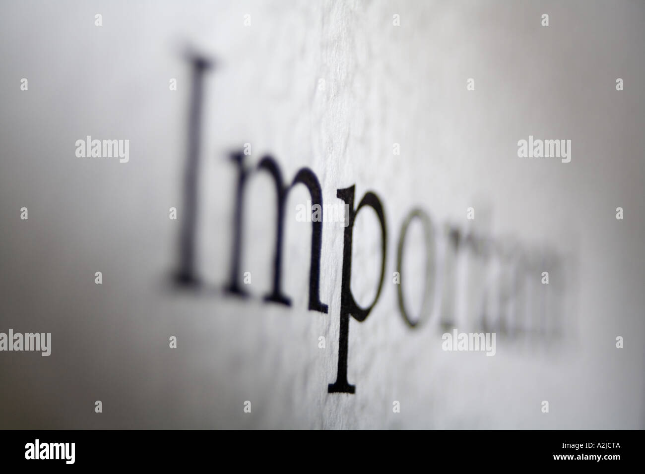 the word important printed on to texture paper Stock Photo - Alamy