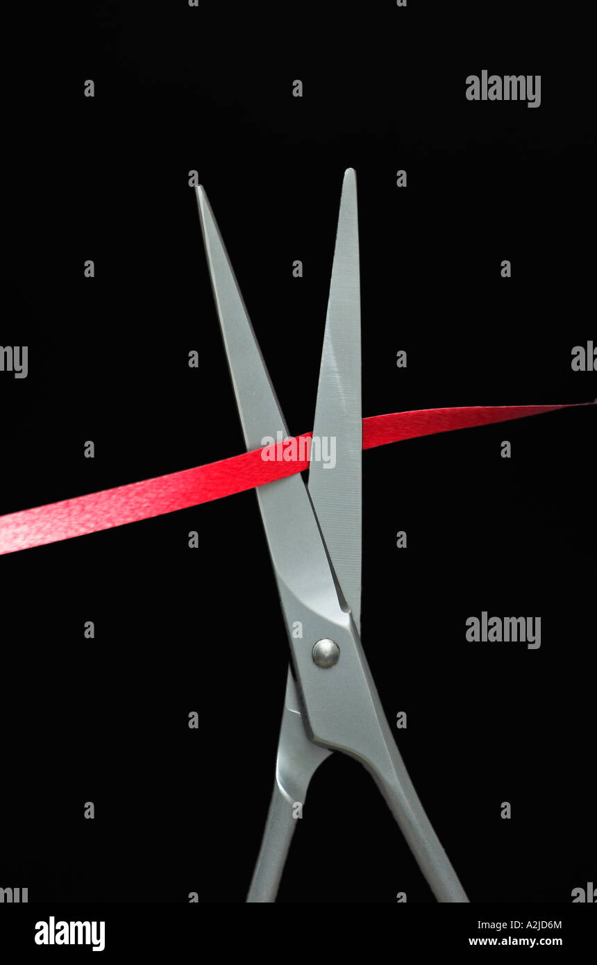 Scissors cutting red tape Stock Photo - Alamy