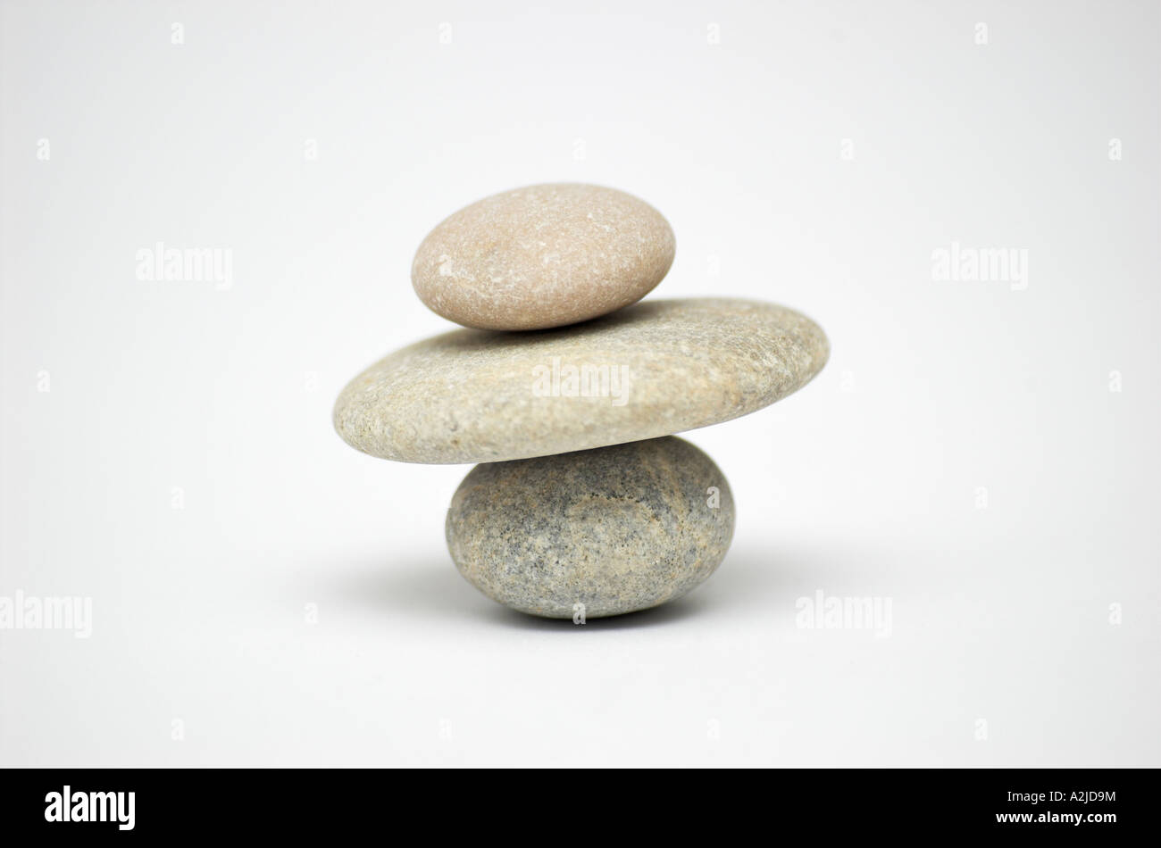 Pebbles on white background Stock Photo - Alamy