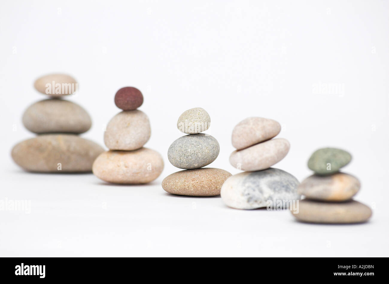 Five stacks of round smooth pebbles Stock Photo - Alamy