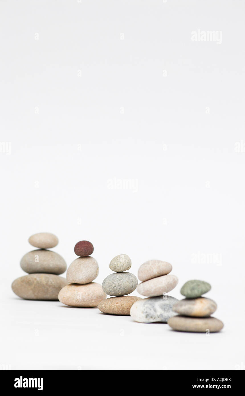Five stacks of round smooth pebbles Stock Photo - Alamy