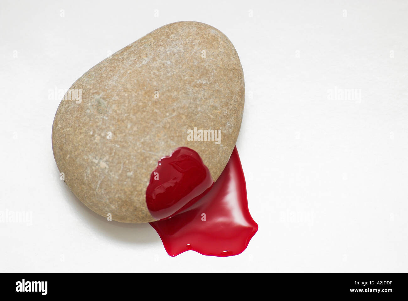 Red liquid on pebble Stock Photo - Alamy