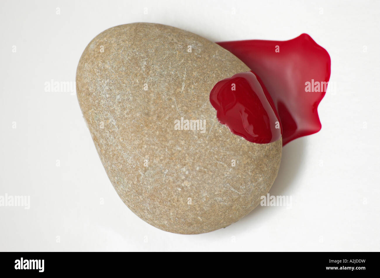 Red liquid on pebble Stock Photo - Alamy