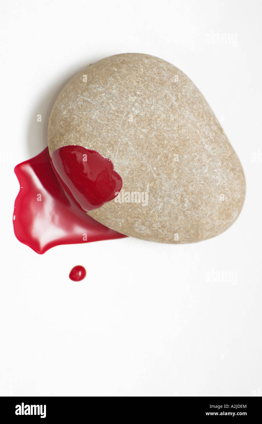 Red liquid on pebble Stock Photo - Alamy