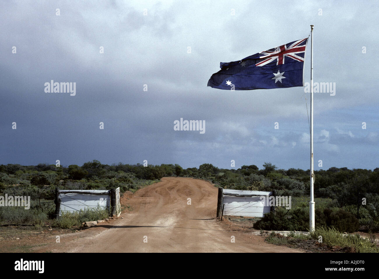 Flag and road Outback Western Australia Stock Photo - Alamy