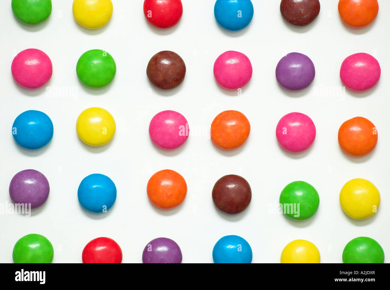 Colourful smarties on white background Stock Photo - Alamy
