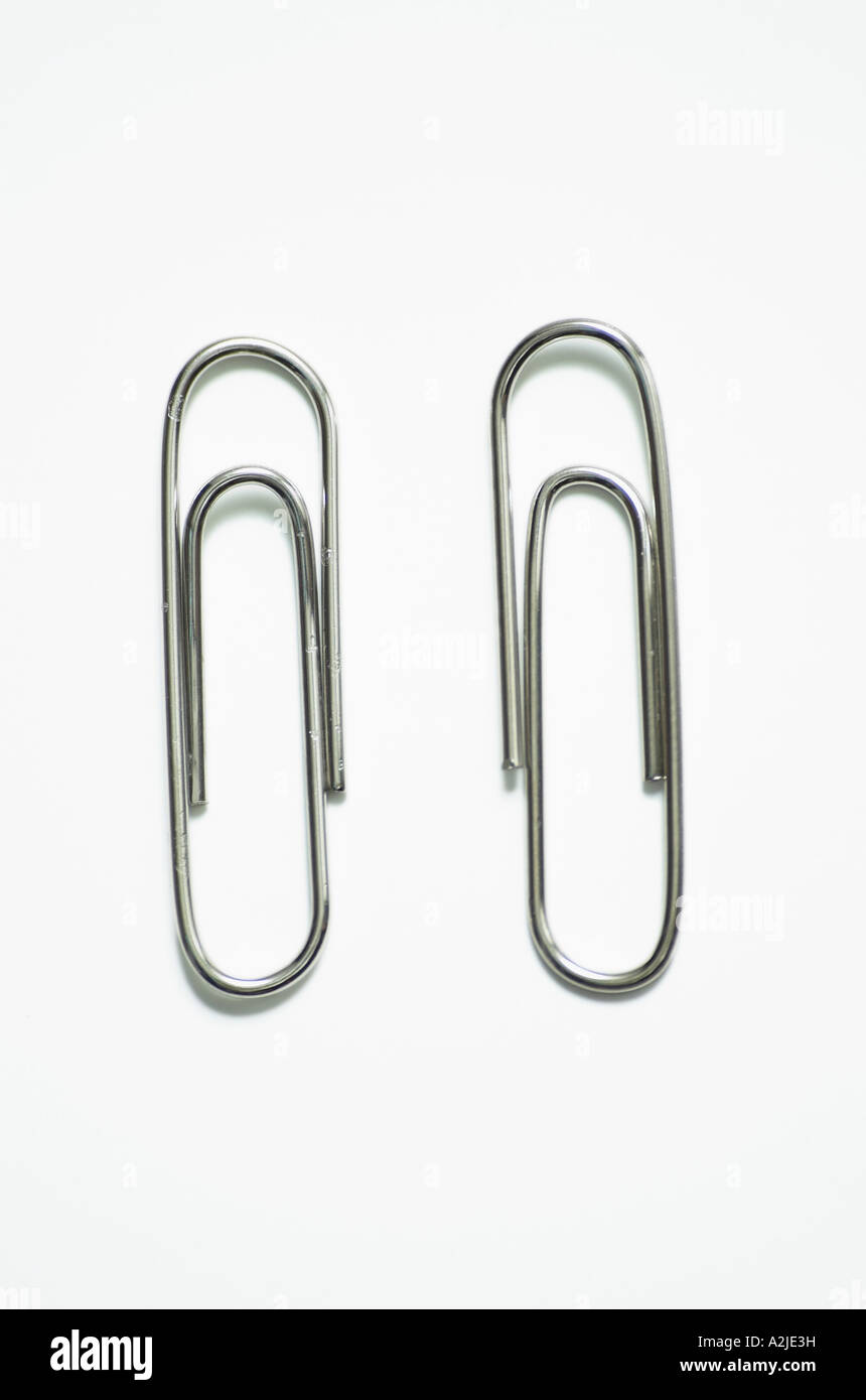 Two paperclips against white background close up Stock Photo - Alamy