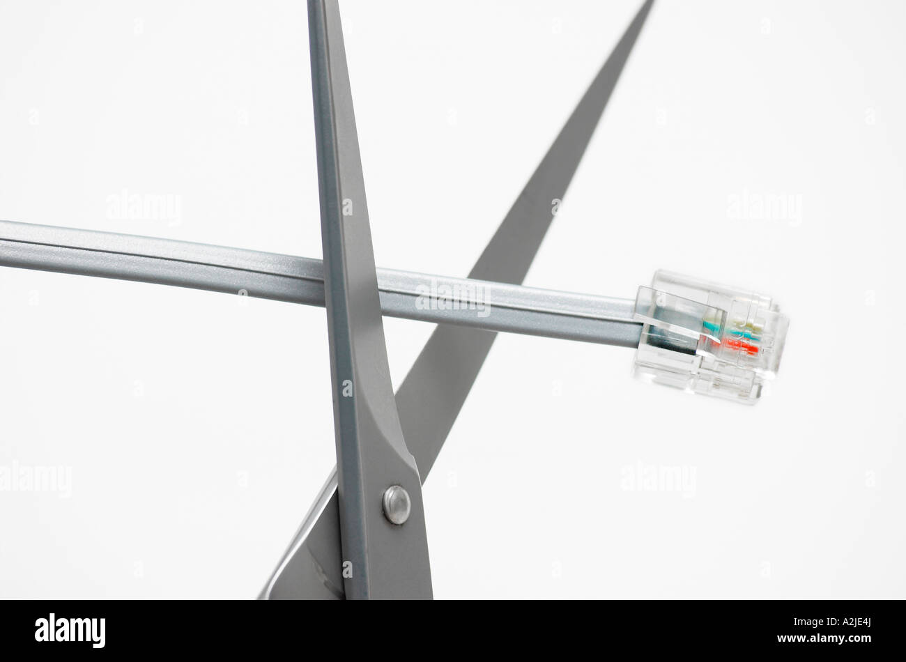 Scissors cutting communications cable Stock Photo - Alamy