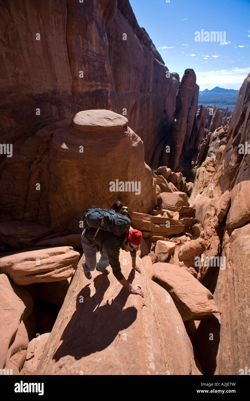 Mark Trevithick scrambling up a rock step while hiking in the Fiery ...