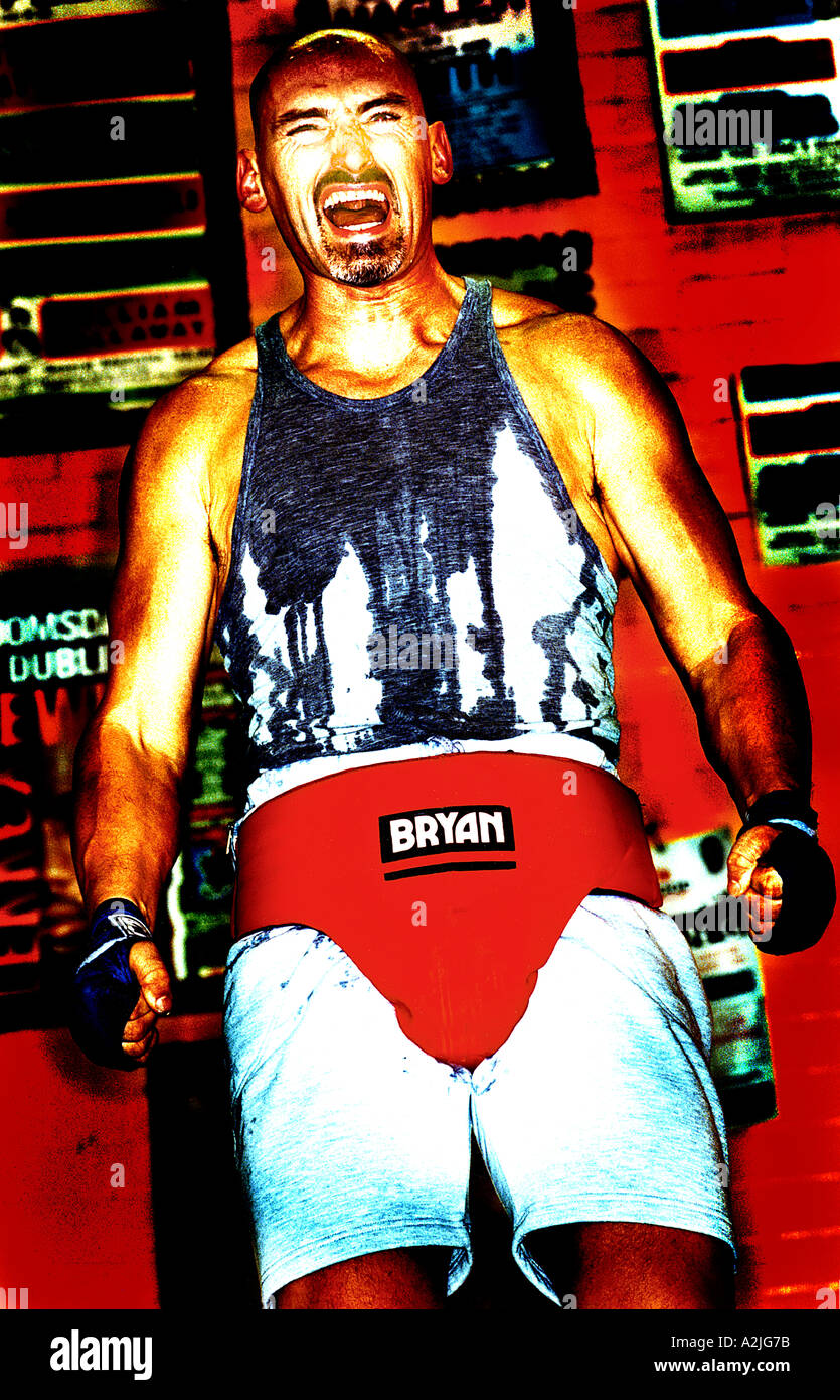 Bald boxer shouting into camera Stock Photo - Alamy