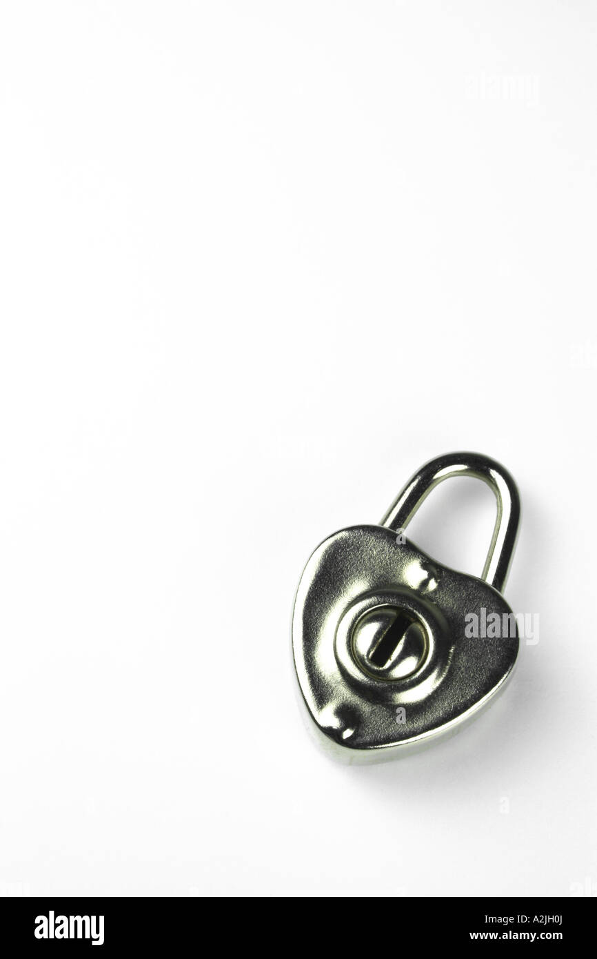 Small metal heart shaped locket Stock Photo - Alamy