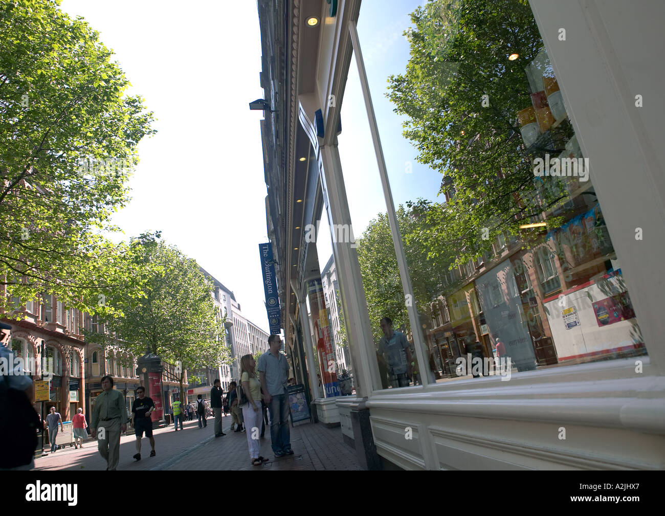 Shoppers look in a shop window, New Street Birmingham, UK Stock Photo ...