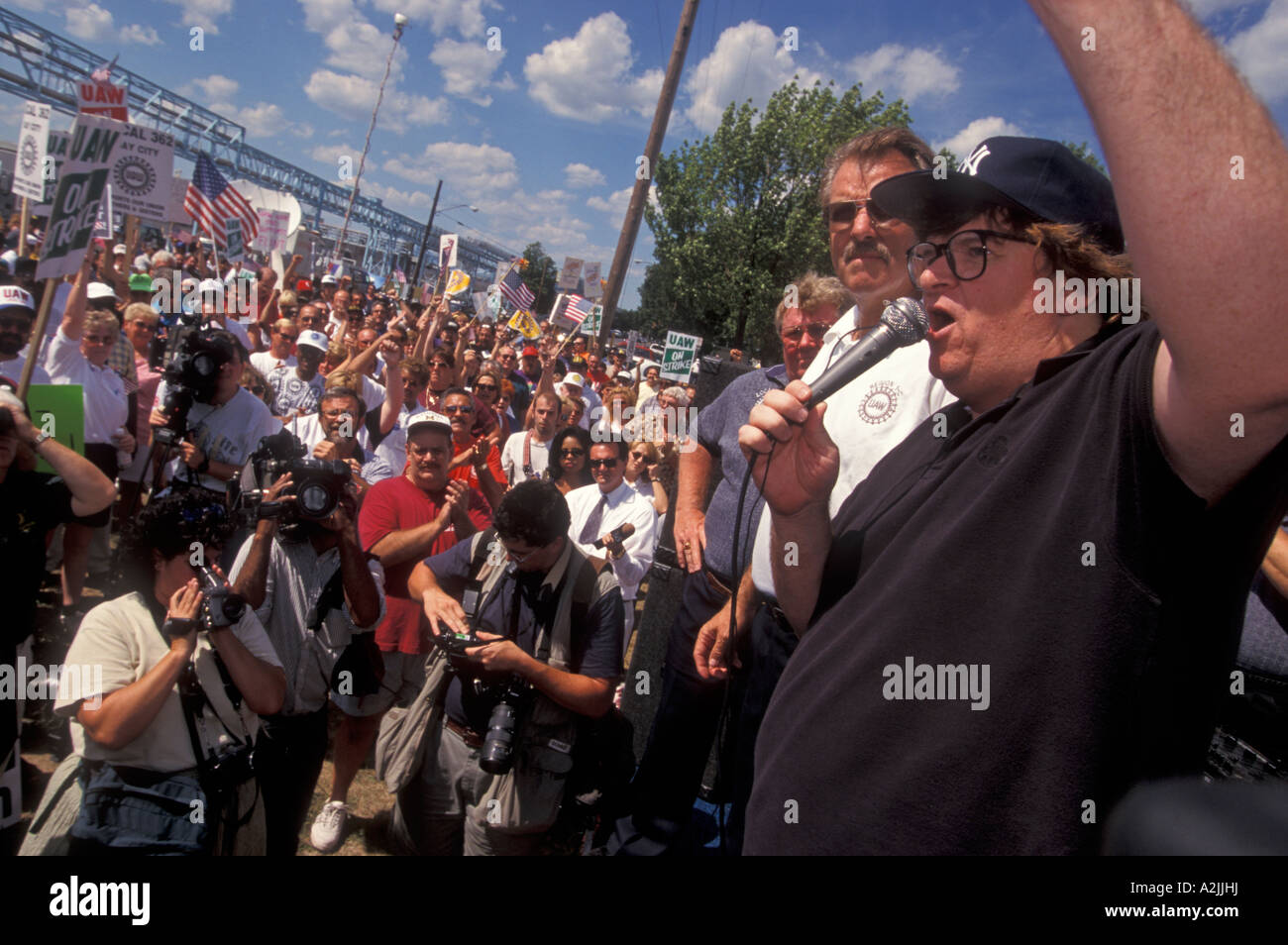 Flint Michigan Michael Moore speaks to auto workers during a strike ...