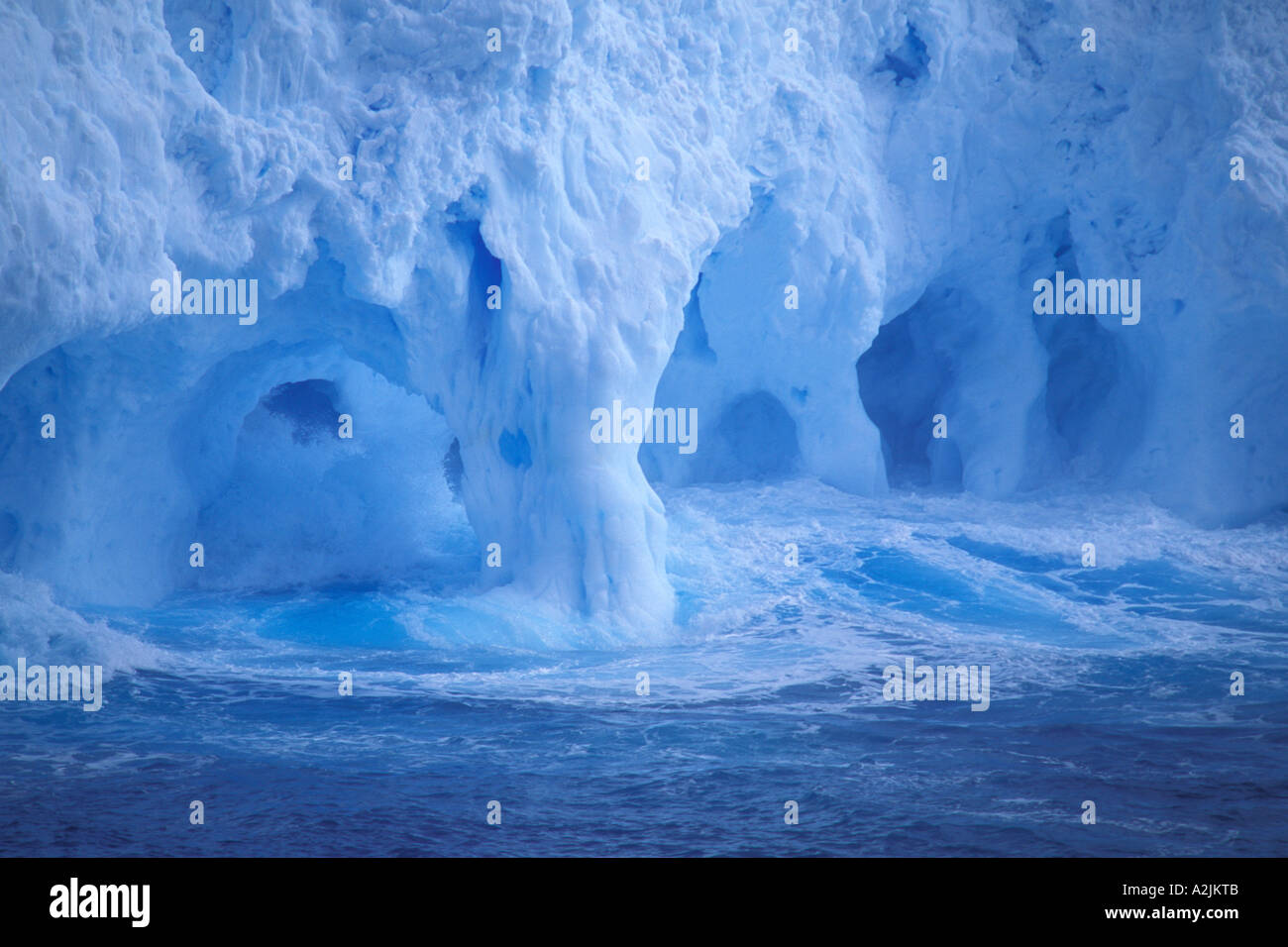 Antarctica. Iceberg with breaking waves Stock Photo - Alamy