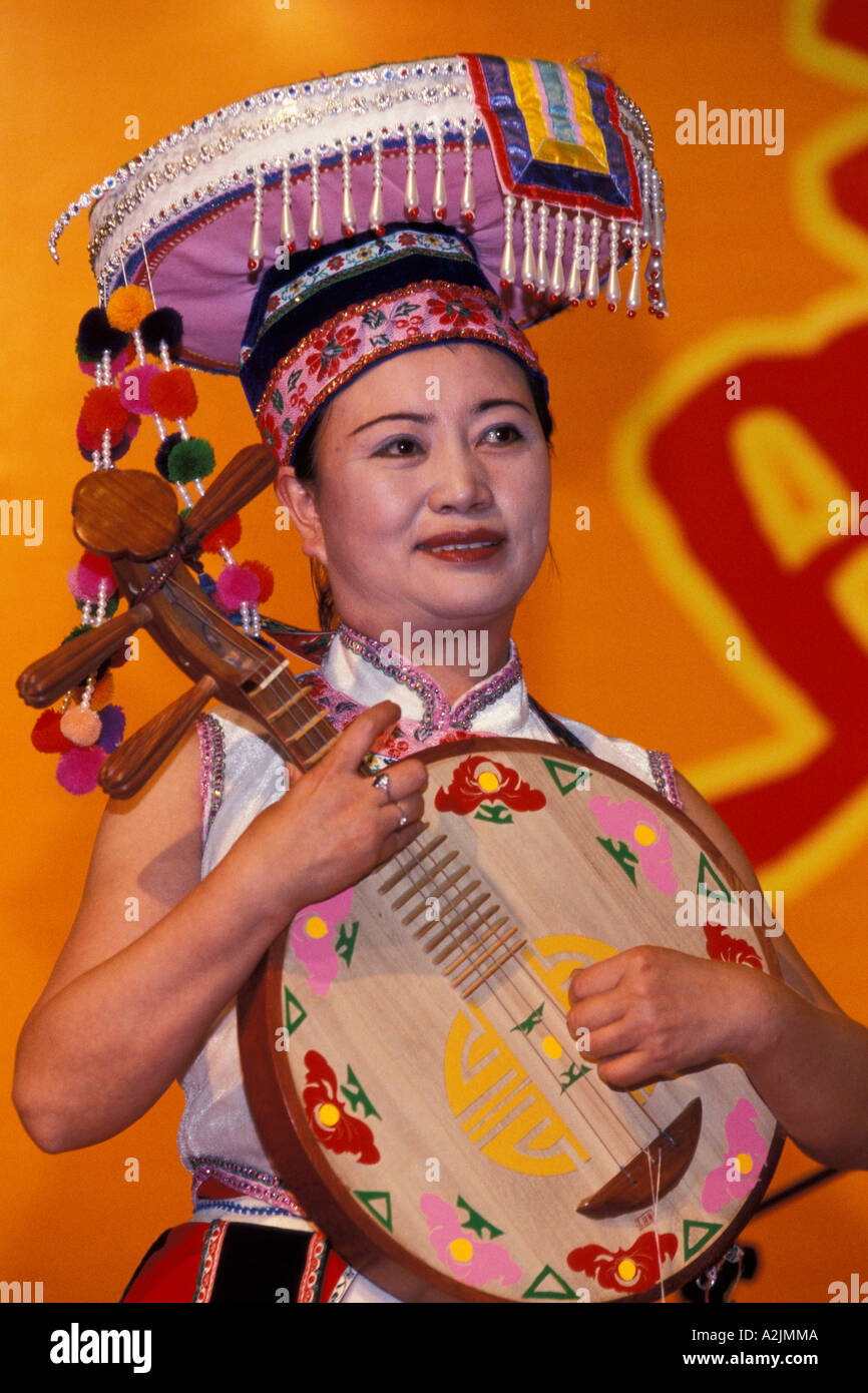 China, Yunnan Province, Kunming. Woman plays the Chinese lute at the ...