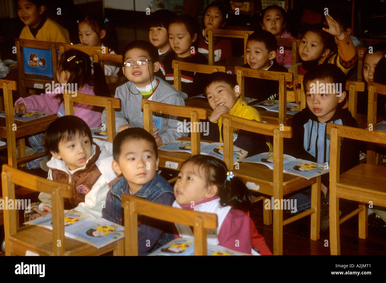 China, Shanghai, Young Chinese children learning in classroom at ...