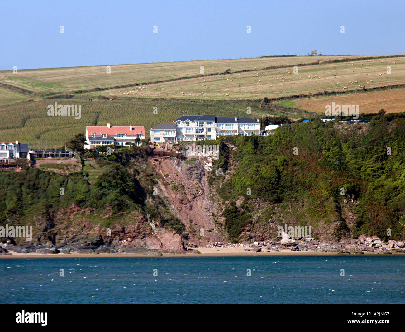Coastal erosion on a cliffside, Bigbury on Sea, Devon, UK Stock Photo ...