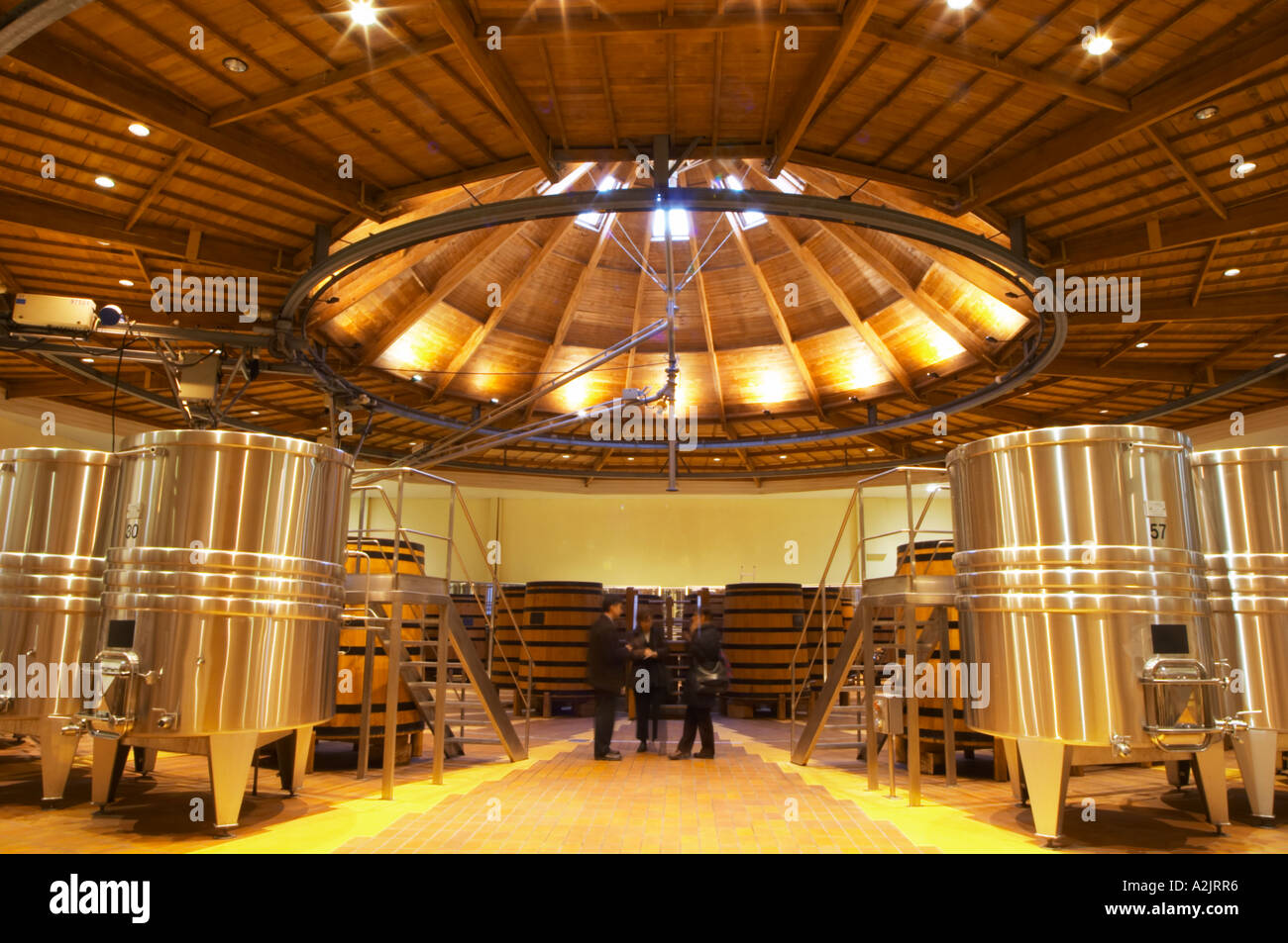 The winery with wooden and stainless steel fermentation vats. It is ...