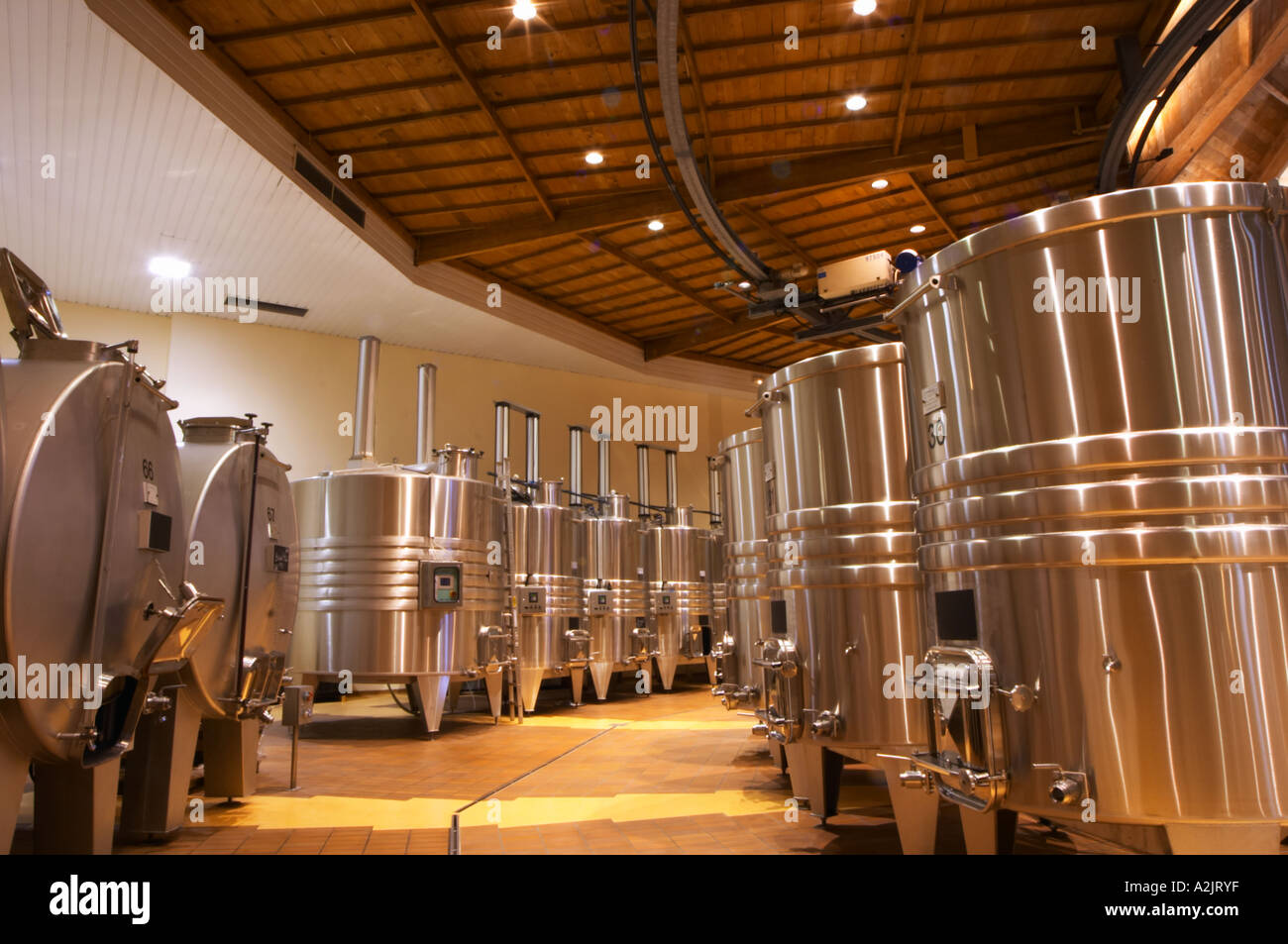 The winery with wooden and stainless steel fermentation vats. It is ...