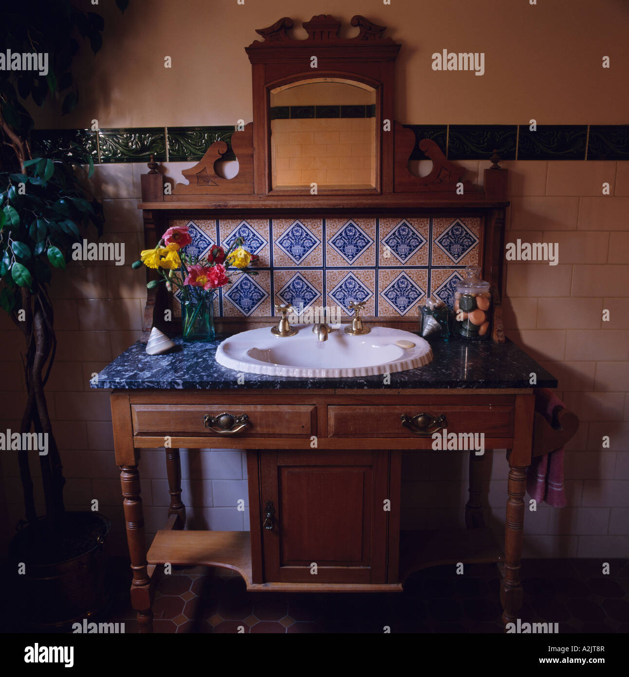 Close-up of basin set into Victorian tiled washstand Stock Photo - Alamy