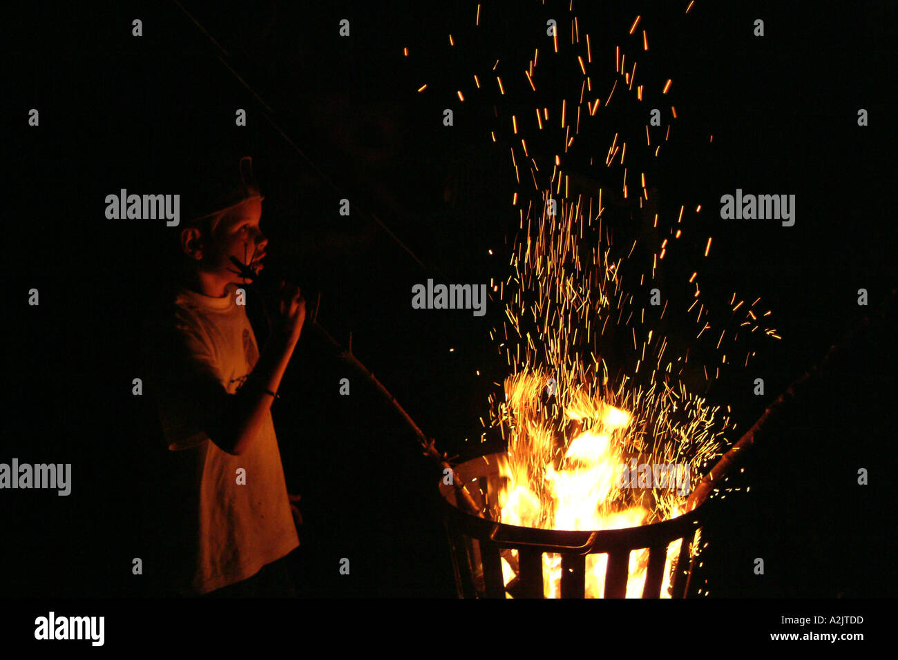 child plays with fire Stock Photo - Alamy