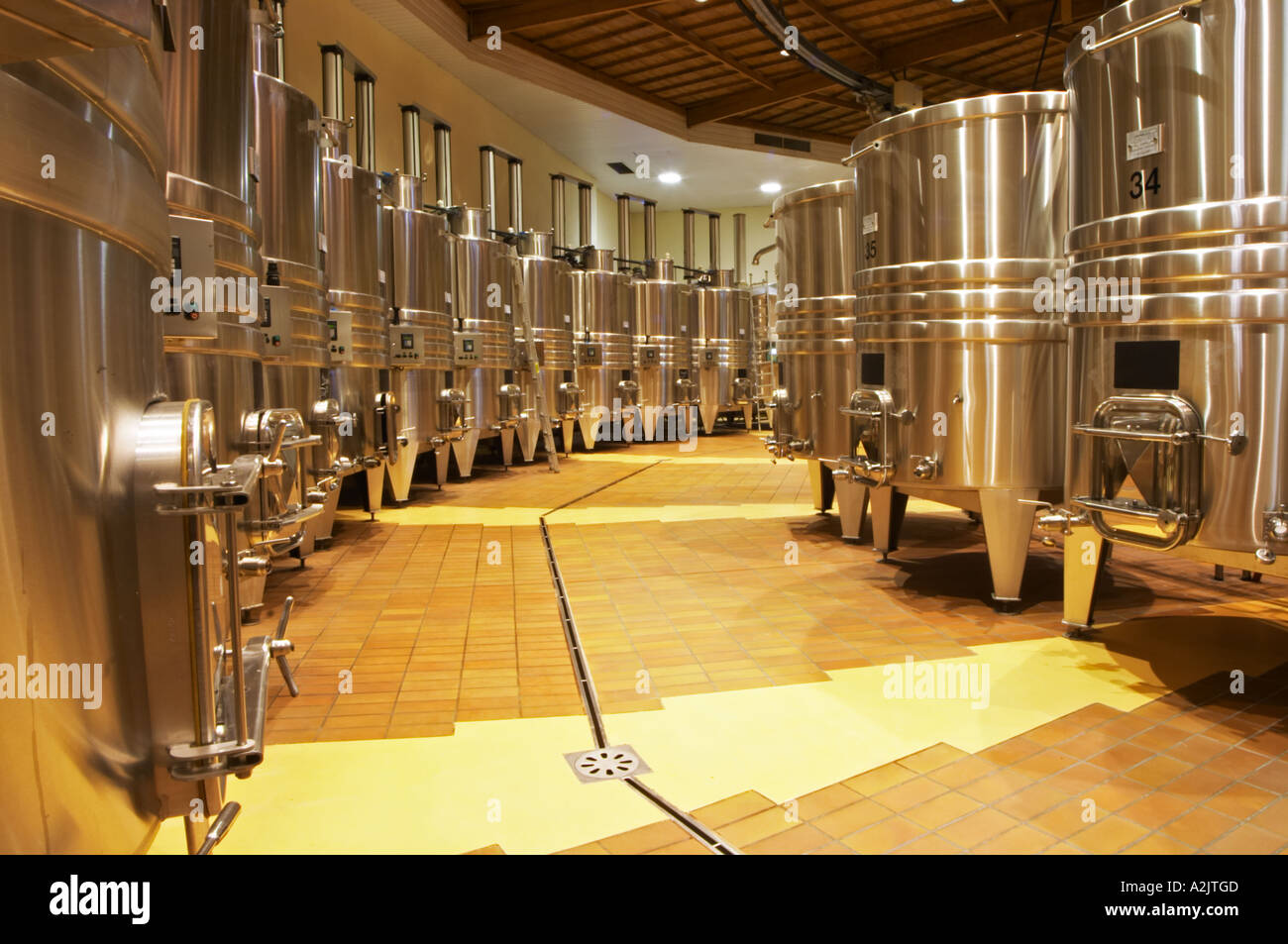 The winery with wooden and stainless steel fermentation vats. It is ...