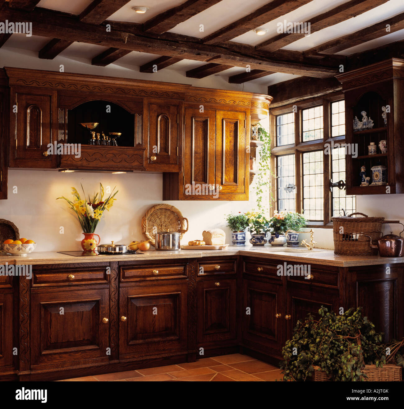 Beamed country kitchen with wooden units Stock Photo - Alamy