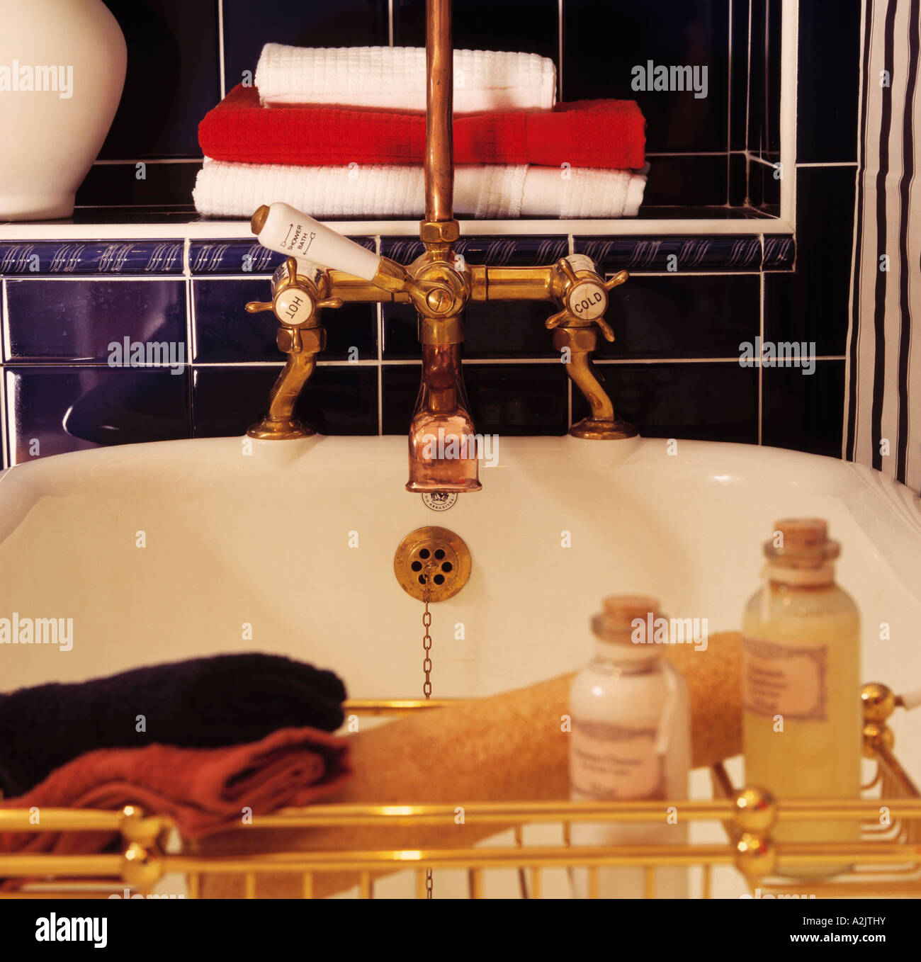 Close-up of bathroom taps and toiletries Stock Photo - Alamy