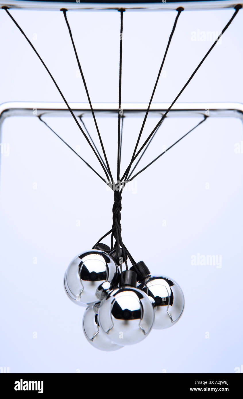 newtons cradle with balls tangled up, close up, portrait format Stock ...