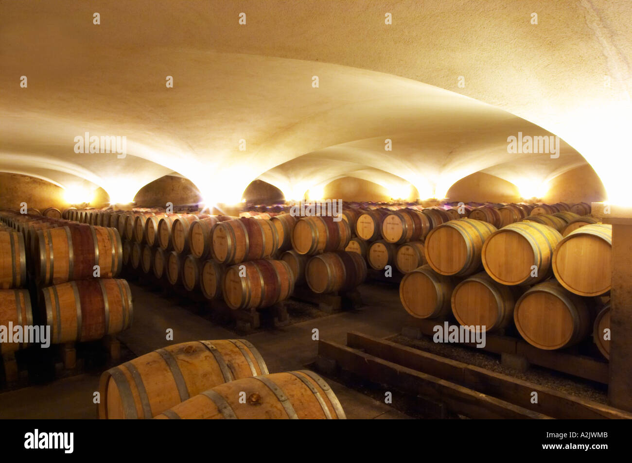 The old style vaulted barrel aging cellar with barriques pieces with ...