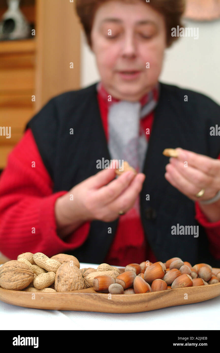 woman eating nuts Stock Photo - Alamy