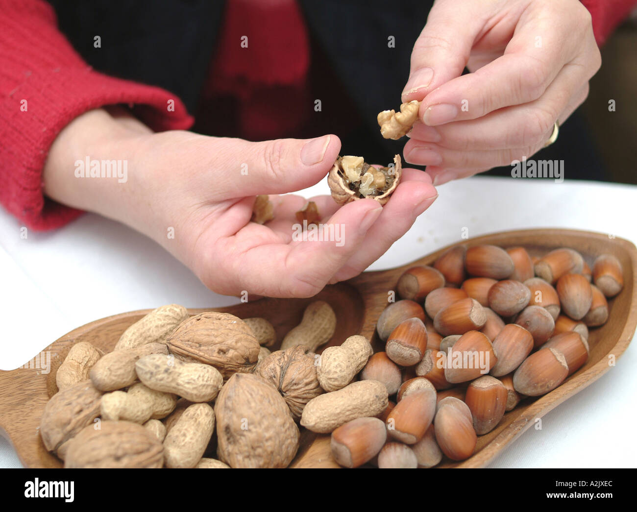 woman eating nuts Stock Photo - Alamy
