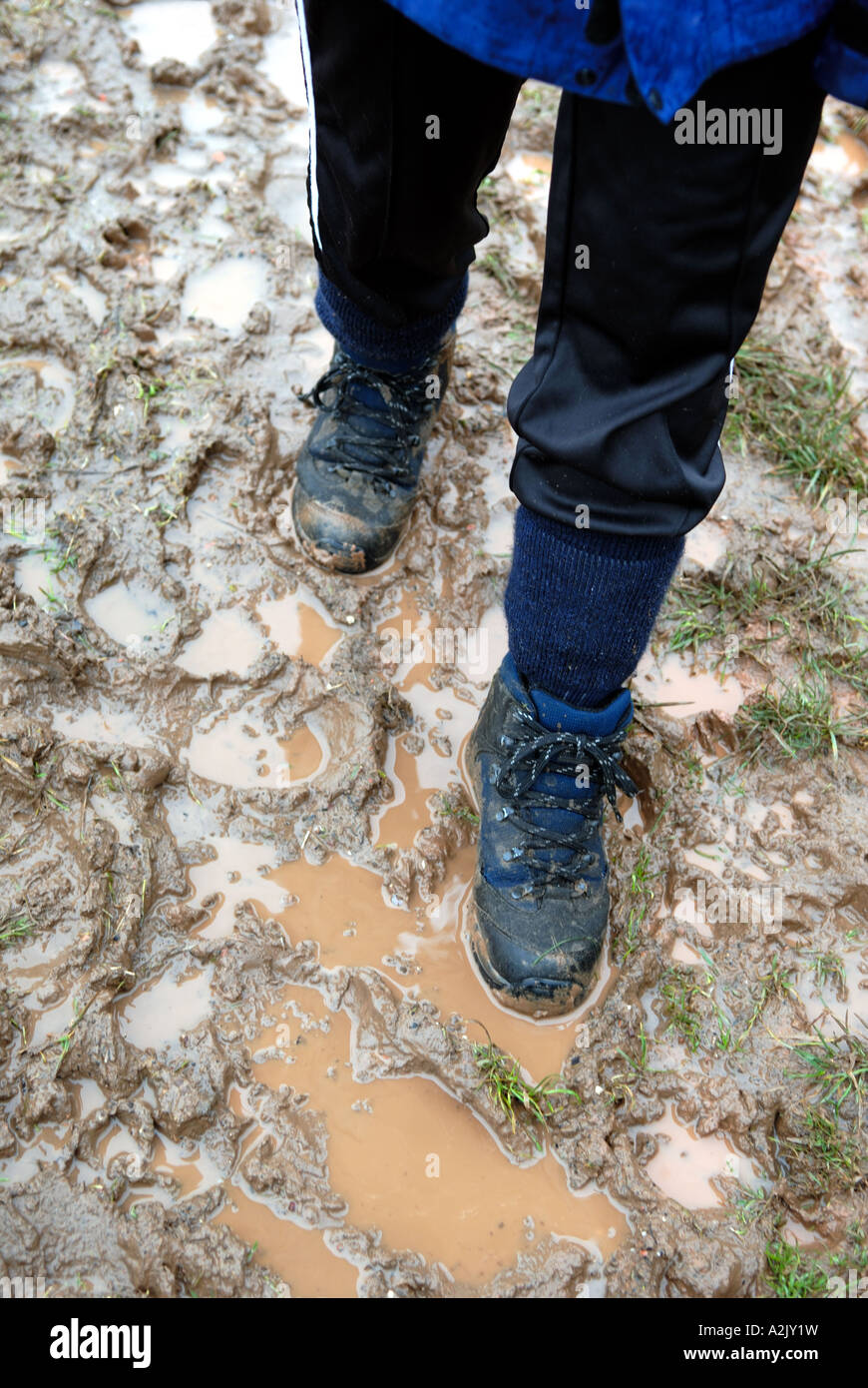 Hiking on muddy path Stock Photo - Alamy